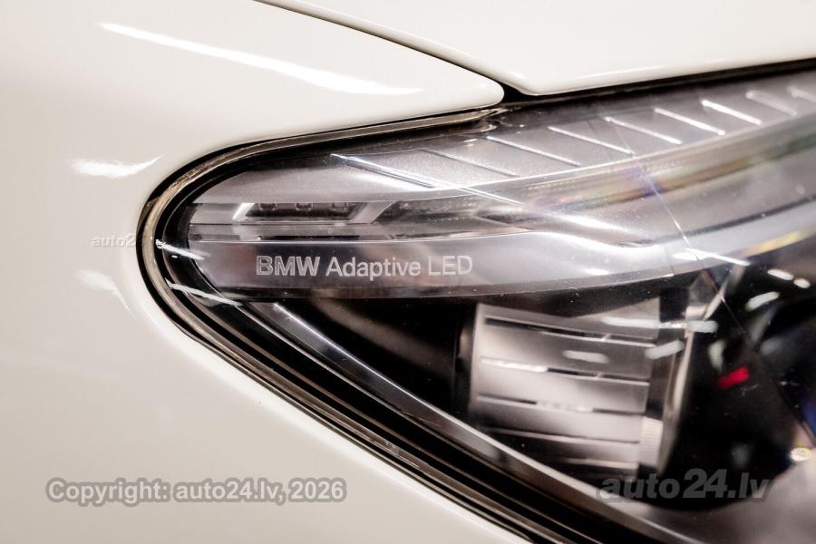 White BMW 7 Series 2013 in Parnu, with an engine capacity of 3.00 L and mileage of 294 thousand km for 14990 €, photo 9 on AUTOMOTO.COM.LV