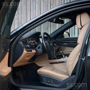 Black BMW 730 2010 in Riga, with an engine capacity of 3.00 L and mileage of 262 thousand km for 8350 €, photo 12 on AUTOMOTO.COM.LV