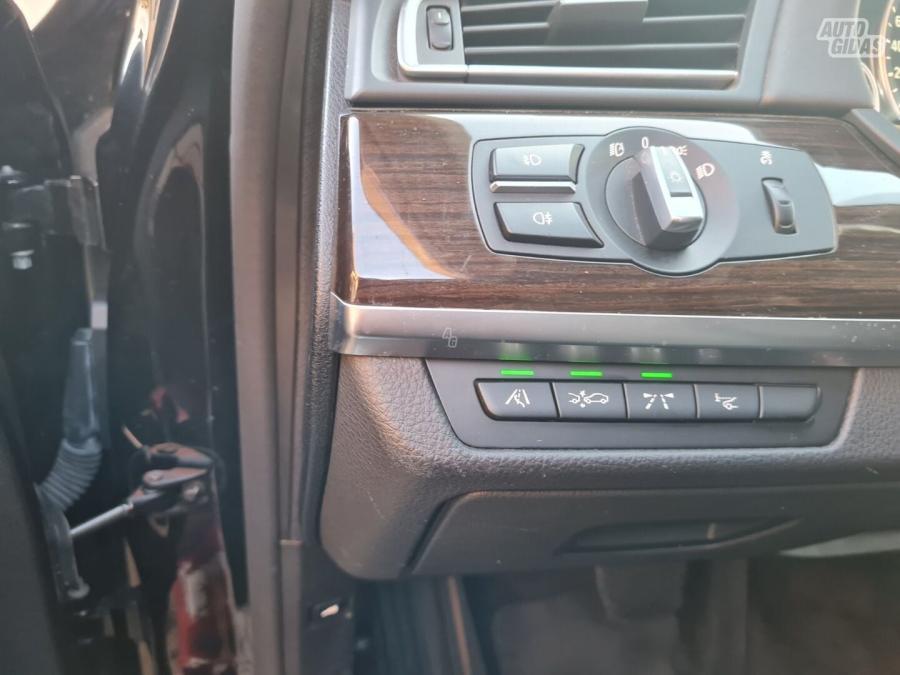 Black BMW 730 2011 in Marijampole, with an engine capacity of 3.00 L and mileage of 80 thousand km for 14500 €, photo 13 on AUTOMOTO.COM.LV