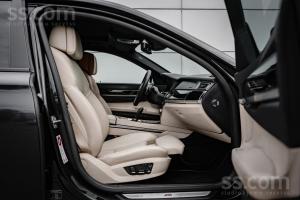 Black BMW 740 2010 in Riga, with an engine capacity of 3.00 L and mileage of 366 thousand km for 8995 €, photo 14 on AUTOMOTO.COM.LV