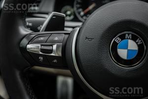 Black BMW 740 2010 in Riga, with an engine capacity of 3.00 L and mileage of 366 thousand km for 8995 €, photo 21 on AUTOMOTO.COM.LV