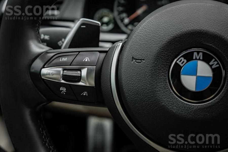 Black BMW 740 2010 in Riga, with an engine capacity of 3.00 L and mileage of 366 thousand km for 8995 €, photo 21 on AUTOMOTO.COM.LV