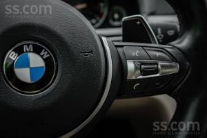 Black BMW 740 2010 in Riga, with an engine capacity of 3.00 L and mileage of 366 thousand km for 8995 €, photo 23 on AUTOMOTO.COM.LV