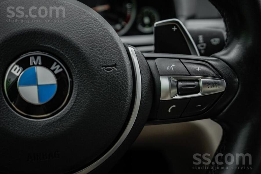 Black BMW 740 2010 in Riga, with an engine capacity of 3.00 L and mileage of 366 thousand km for 8995 €, photo 23 on AUTOMOTO.COM.LV