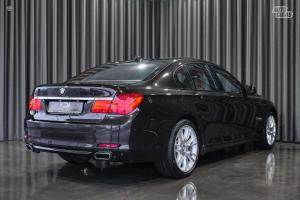 Black BMW 740 2011 in Marijampole, with an engine capacity of 3.00 L and mileage of 219 thousand km for 13850 €, photo 12 on AUTOMOTO.COM.LV