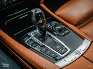 Black BMW 740 2011 in Marijampole, with an engine capacity of 3.00 L and mileage of 219 thousand km for 13950 €, photo 21 on AUTOMOTO.COM.LV