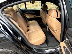 Black BMW 740 2012 in Saldus, with an engine capacity of 3.00 L and mileage of 262 thousand km for 11950 €, photo 12 on AUTOMOTO.COM.LV