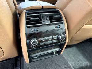 Black BMW 740 2012 in Saldus, with an engine capacity of 3.00 L and mileage of 262 thousand km for 11950 €, photo 14 on AUTOMOTO.COM.LV