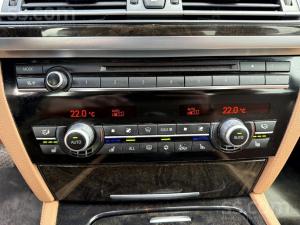 Black BMW 740 2012 in Saldus, with an engine capacity of 3.00 L and mileage of 262 thousand km for 11950 €, photo 26 on AUTOMOTO.COM.LV