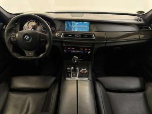 Black BMW 740 2012 in Marijampole, with an engine capacity of 2.99 L and mileage of 222 thousand km for 12450 €, photo 6 on AUTOMOTO.COM.LV