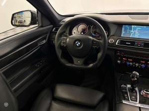Black BMW 740 2012 in Marijampole, with an engine capacity of 2.99 L and mileage of 222 thousand km for 12450 €, photo 18 on AUTOMOTO.COM.LV