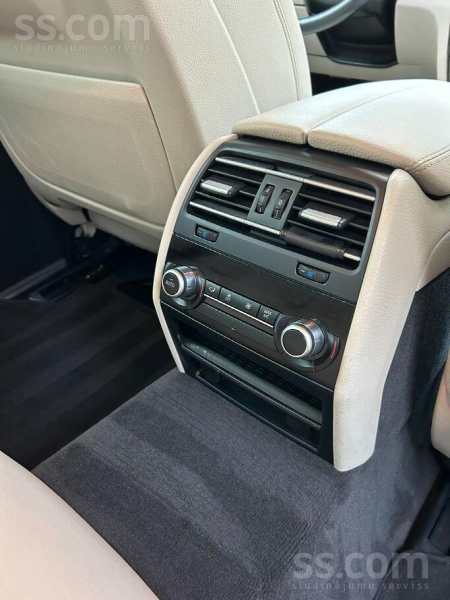 Black BMW 740 2012 in Jurmala, with an engine capacity of 3.00 L and mileage of 188 thousand km for 14300 €, photo 16 on AUTOMOTO.COM.LV
