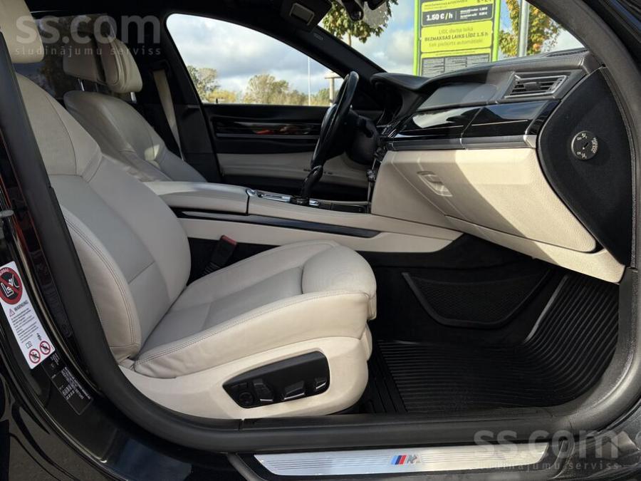 Black BMW 740 2012 in Riga, with an engine capacity of 3.00 L and mileage of 0 thousand km for 9990 €, photo 11 on AUTOMOTO.COM.LV