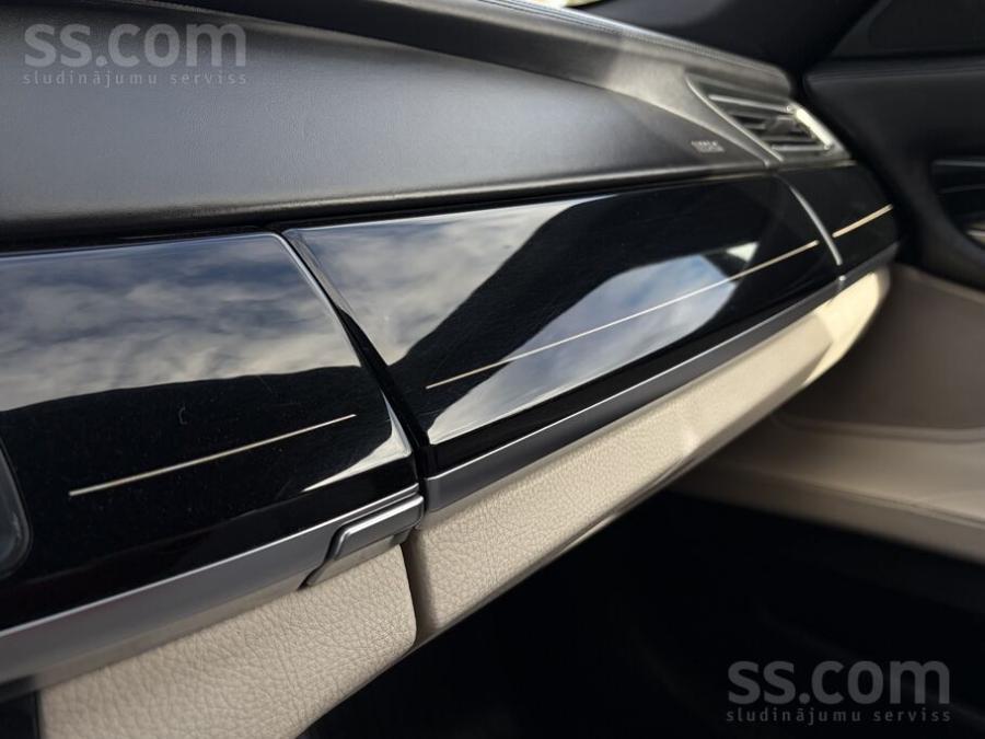 Black BMW 740 2012 in Riga, with an engine capacity of 3.00 L and mileage of 0 thousand km for 9990 €, photo 23 on AUTOMOTO.COM.LV