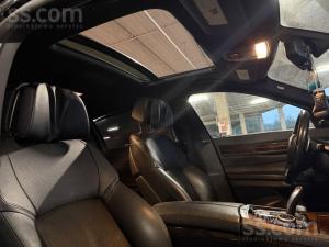 Black BMW 740 2013 in Riga, with an engine capacity of 3.00 L and mileage of 304 thousand km for 12750 €, photo 18 on AUTOMOTO.COM.LV