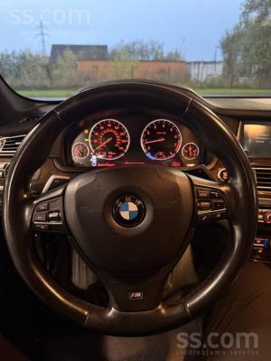 Black BMW 740 2013 in Riga, with an engine capacity of 3.00 L and mileage of 304 thousand km for 12750 €, photo 27 on AUTOMOTO.COM.LV