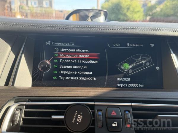 Black BMW 740 2015 in Riga, with an engine capacity of 3.00 L and mileage of 297 thousand km for 15000 €, photo 11 on AUTOMOTO.COM.LV