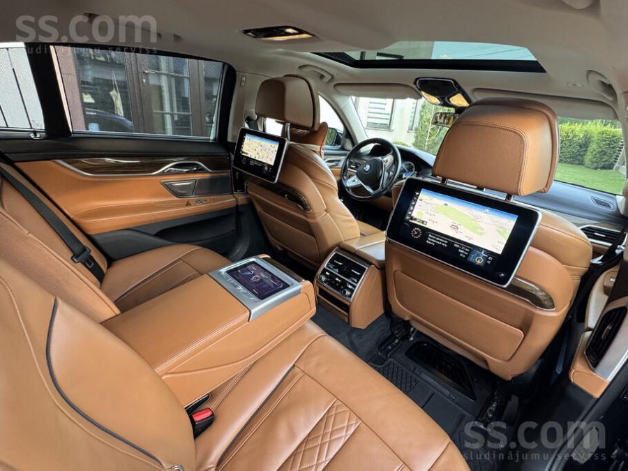 Black BMW 740 2016 in Riga, with an engine capacity of 3.00 L and mileage of 227 thousand km for 26200 €, photo 7 on AUTOMOTO.COM.LV
