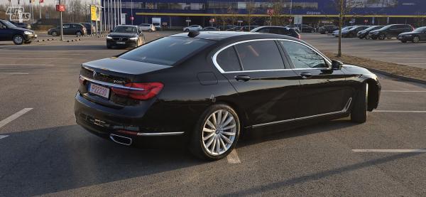 Black BMW 740 2018 in Vilnius, with an engine capacity of 3.00 L and mileage of 169 thousand km for 21499 €, photo 2 on AUTOMOTO.COM.LV