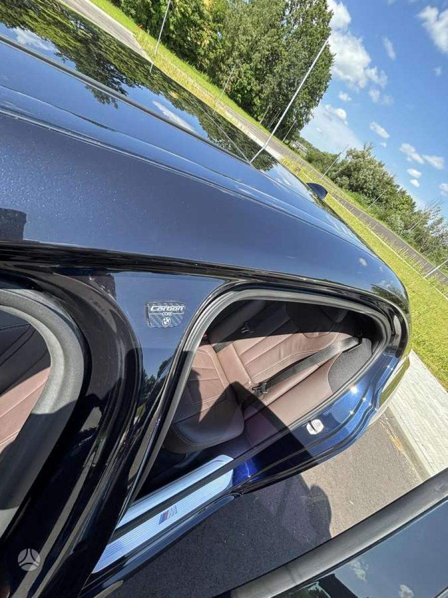 Black BMW 740 2021 in Vilnius, with an engine capacity of 3.00 L and mileage of 100 thousand km for 39500 €, photo 13 on AUTOMOTO.COM.LV