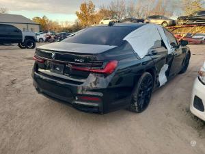 Black BMW 740 2022 in Vilnius, with an engine capacity of 3.00 L and mileage of 105 thousand km for 19400 €, photo 4 on AUTOMOTO.COM.LV