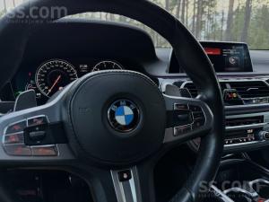 Blue BMW 740 2018 in Riga, with an engine capacity of 3.00 L and mileage of 208 thousand km for 30000 €, photo 19 on AUTOMOTO.COM.LV