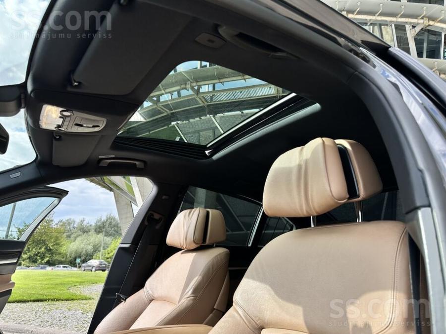Grey BMW 740 2012 in Riga, with an engine capacity of 3.00 L and mileage of 312 thousand km for 13800 €, photo 14 on AUTOMOTO.COM.LV
