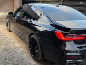 Black BMW 745 2019 in Taurage, with an engine capacity of 0.00 L and mileage of 106 thousand km for 35999 €, photo 6 on AUTOMOTO.COM.LV