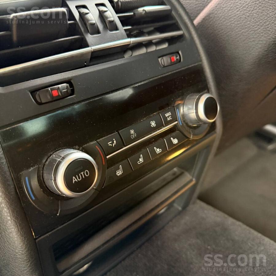 Black BMW 750 2013 in Riga, with an engine capacity of 3.00 L and mileage of 292 thousand km for 9990 €, photo 16 on AUTOMOTO.COM.LV