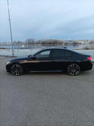 Black BMW 750 2016 in Vilnius, with an engine capacity of 4.40 L and mileage of 205 thousand km for 26000 €, photo 9 on AUTOMOTO.COM.LV