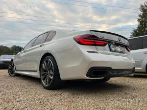 White BMW 750 2016 in Riga, with an engine capacity of 4.40 L and mileage of 173 thousand km for 31750 €, photo  on AUTOMOTO.COM.LV