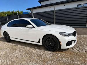 White BMW 750 2016 in Vilnius, with an engine capacity of 4.40 L and mileage of 148 thousand km for 15999 €, photo 4 on AUTOMOTO.COM.LV