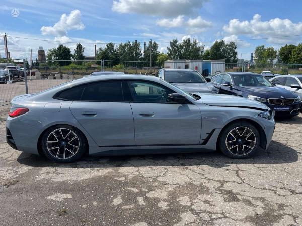 Grey BMW i4 2023 in Panevezys, with an engine capacity of 0.00 L and mileage of 57 thousand km for 18800 €, photo 3 on AUTOMOTO.COM.LV