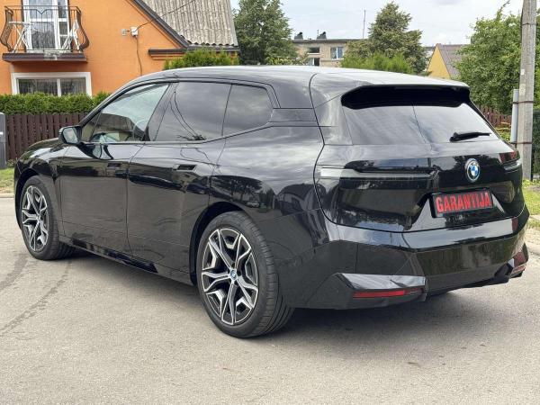 Black BMW iX 2022 in Siauliai, with an engine capacity of 0.00 L and mileage of 140 thousand km for 38700 €, photo 5 on AUTOMOTO.COM.LV