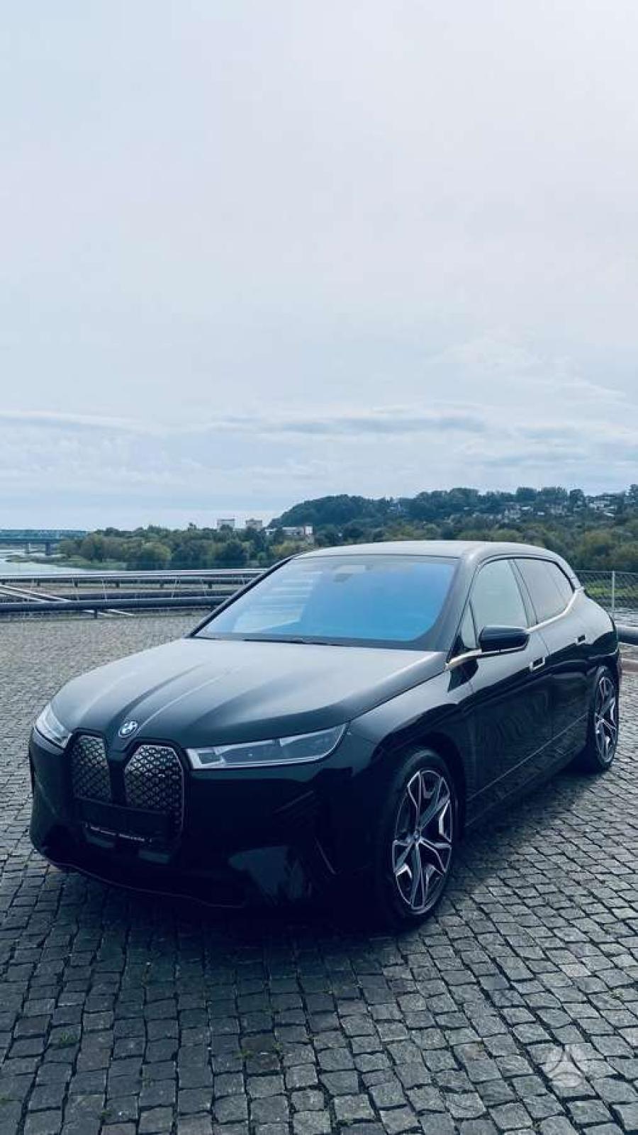 Black BMW iX 2023 in Kaunas, with an engine capacity of 0.00 L and mileage of 24 thousand km for 48500 €, photo 1 on AUTOMOTO.COM.LV