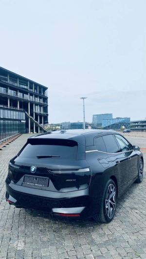 Black BMW iX 2023 in Kaunas, with an engine capacity of 0.00 L and mileage of 24 thousand km for 48500 €, photo 4 on AUTOMOTO.COM.LV
