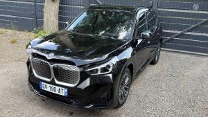 Black BMW iX1 2024 in Jonava, with an engine capacity of 0.00 L and mileage of 43 thousand km for 23600 €, photo 6 on AUTOMOTO.COM.LV