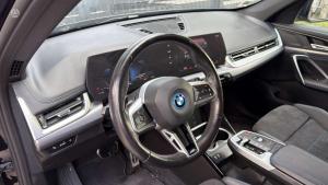 Black BMW iX1 2024 in Jonava, with an engine capacity of 0.00 L and mileage of 43 thousand km for 23600 €, photo 22 on AUTOMOTO.COM.LV