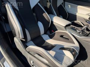 Black BMW M4 2021 in Riga, with an engine capacity of 3.00 L and mileage of 60 thousand km for 65900 €, photo 7 on AUTOMOTO.COM.LV