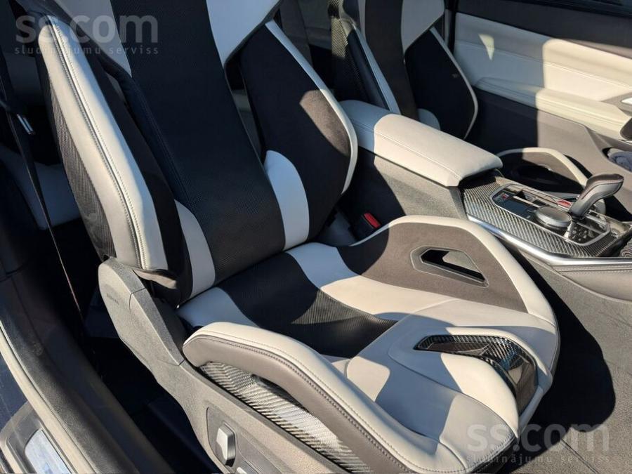 Black BMW M4 2021 in Riga, with an engine capacity of 3.00 L and mileage of 60 thousand km for 65900 €, photo 7 on AUTOMOTO.COM.LV