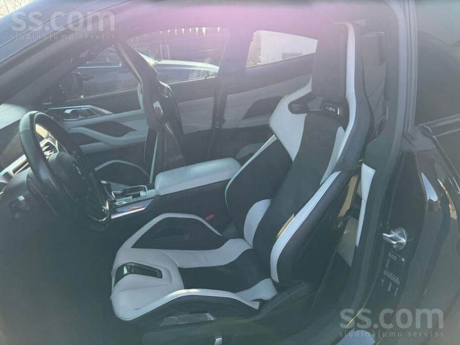Black BMW M4 2021 in Riga, with an engine capacity of 3.00 L and mileage of 60 thousand km for 65900 €, photo 11 on AUTOMOTO.COM.LV