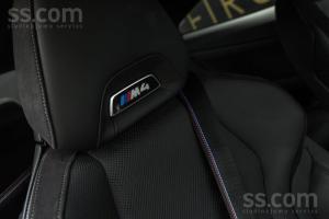 Black BMW M4 2022 in Tukums, with an engine capacity of 3.00 L and mileage of 68 thousand km for 69990 €, photo 10 on AUTOMOTO.COM.LV