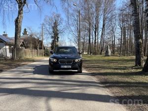Black BMW X1 2010 in Riga, with an engine capacity of 2.00 L and mileage of 209 thousand km for 6500 €, photo  on AUTOMOTO.COM.LV