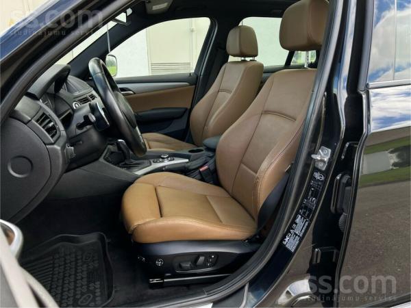 Black BMW X1 2012 in Cesis, with an engine capacity of 2.00 L and mileage of 224 thousand km for 10800 €, photo 8 on AUTOMOTO.COM.LV