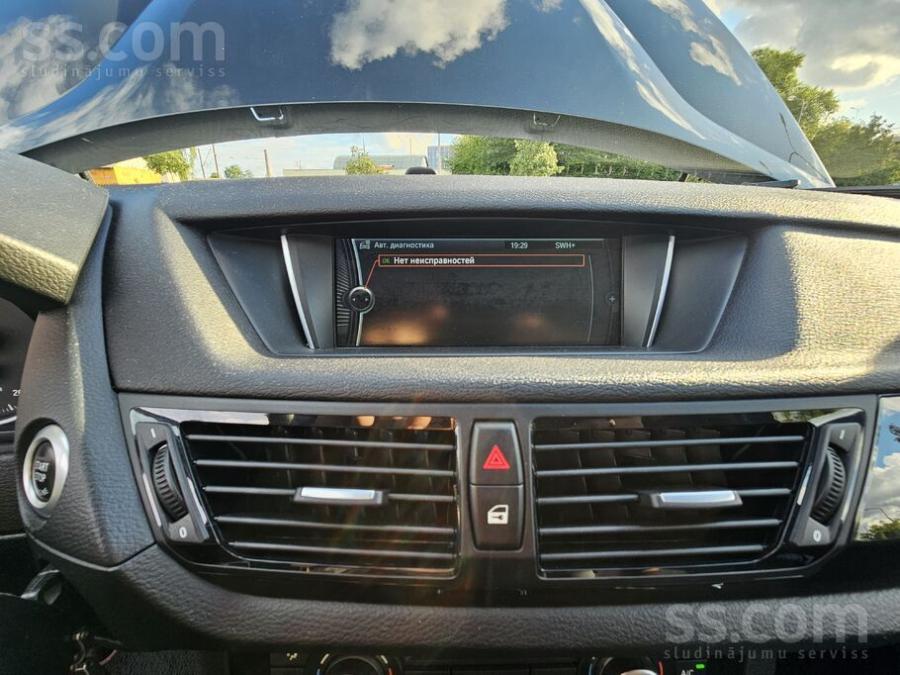 Black BMW X1 2012 in Riga, with an engine capacity of 2.00 L and mileage of 278 thousand km for 12498 €, photo 14 on AUTOMOTO.COM.LV