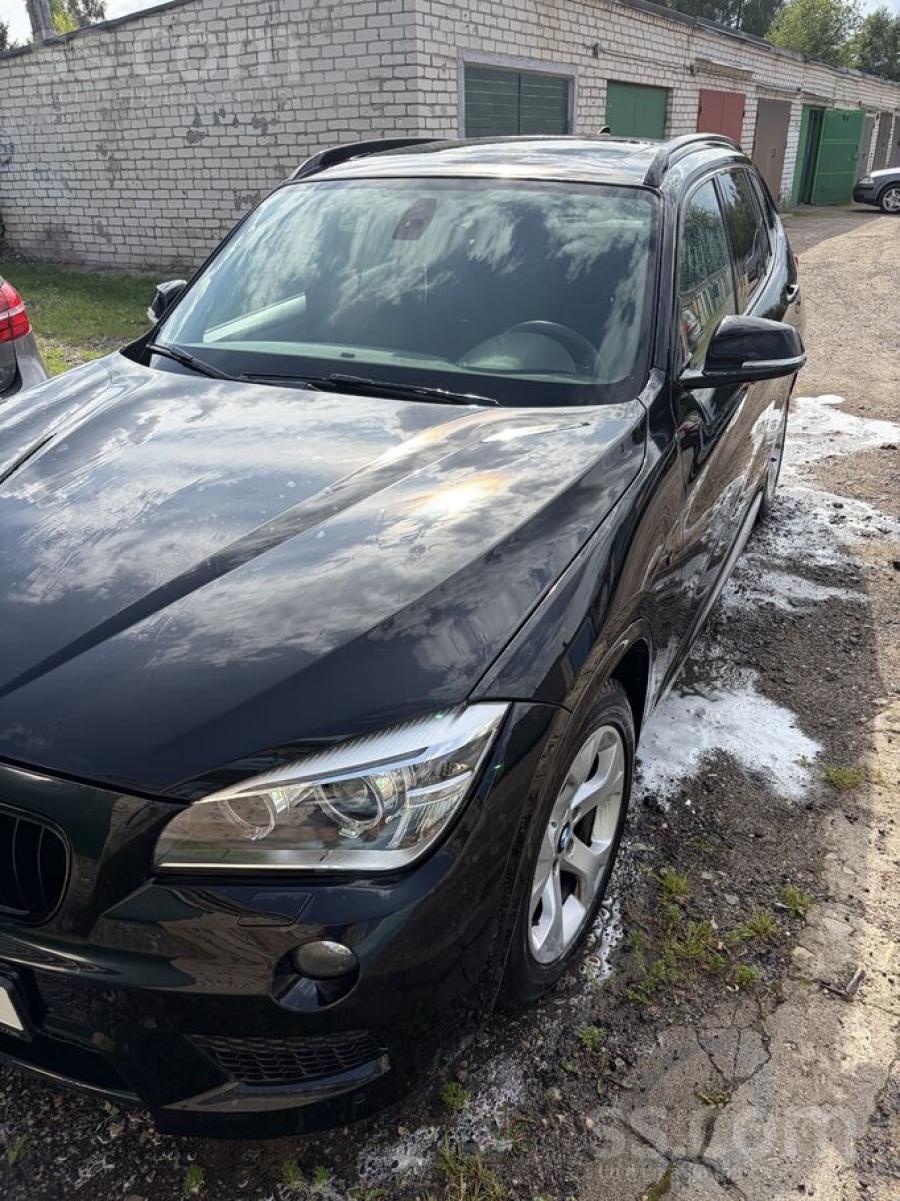 Black BMW X1 2012 in Riga, with an engine capacity of 2.00 L and mileage of 310 thousand km for 8695 €, photo 11 on AUTOMOTO.COM.LV