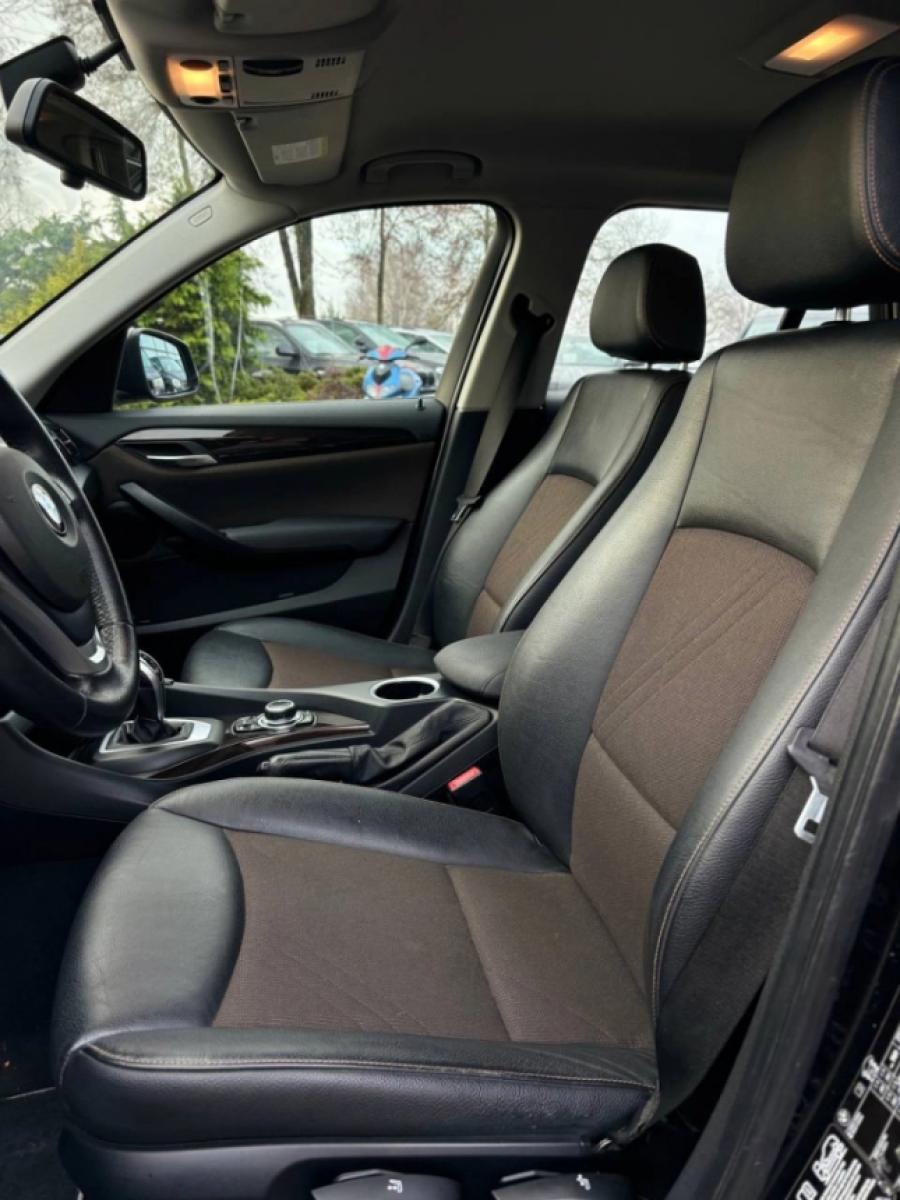 Black BMW X1 2013 in Riga, with an engine capacity of 2.00 L and mileage of 181 thousand km for 9499 €, photo 15 on AUTOMOTO.COM.LV