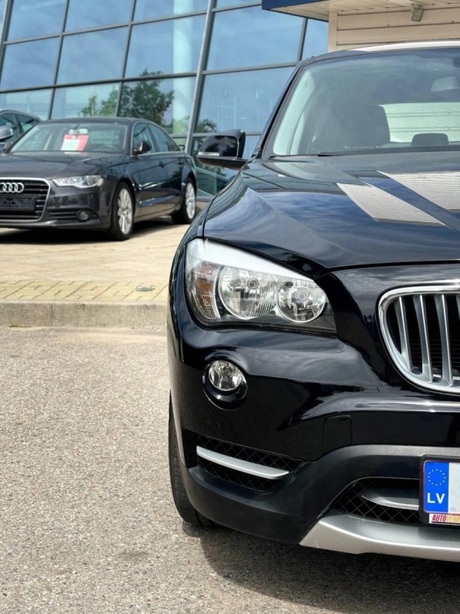 Black BMW X1 2013 in Riga, with an engine capacity of 2.00 L and mileage of 181 thousand km for 9499 €, photo 16 on AUTOMOTO.COM.LV
