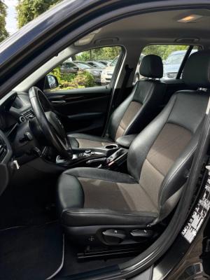 Black BMW X1 2013 in Riga, with an engine capacity of 2.00 L and mileage of 181 thousand km for 9499 €, photo 18 on AUTOMOTO.COM.LV
