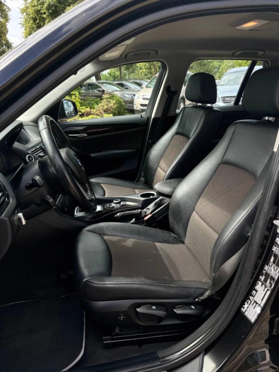 Black BMW X1 2013 in Riga, with an engine capacity of 2.00 L and mileage of 181 thousand km for 9499 €, photo 18 on AUTOMOTO.COM.LV